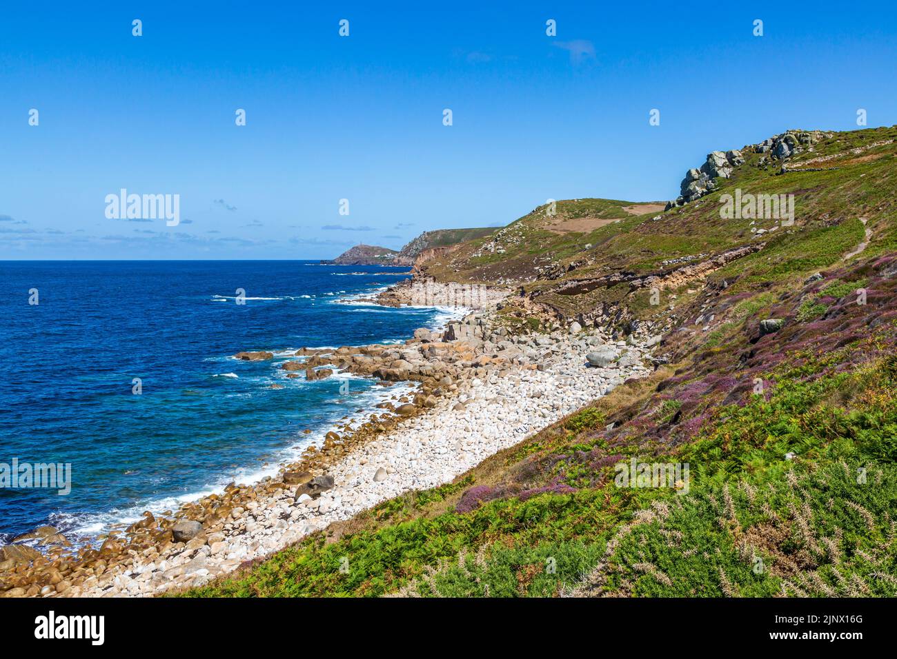 The rugged Cornish coast with a blue sky overhead Stock Photo - Alamy