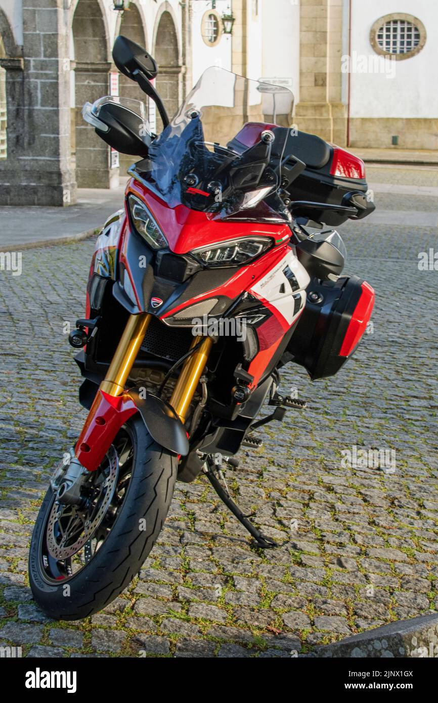 Powerful motorcycle in red and black colors parked on the street in a ...
