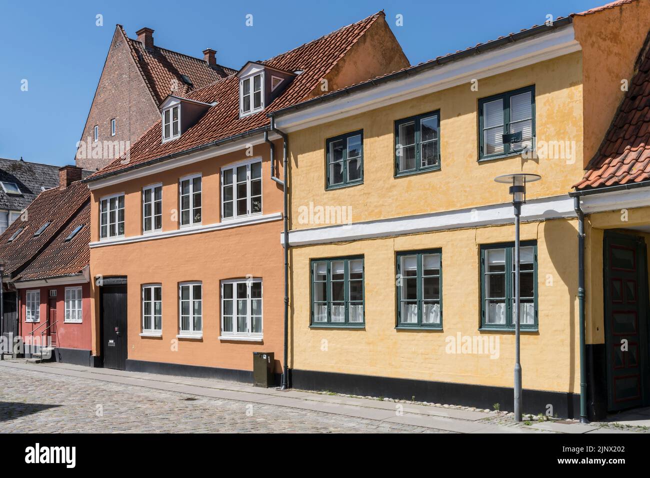 cityscape with traditional picturesque houses on cobbled street , shot ...