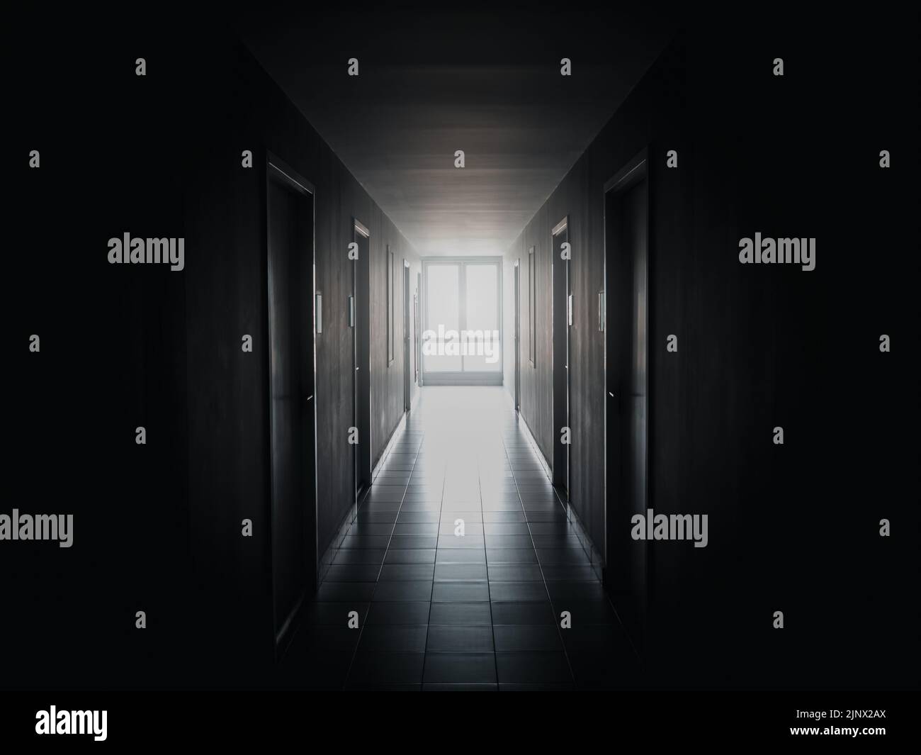 The light at the window at end of the way on dark mysterious corridor ...