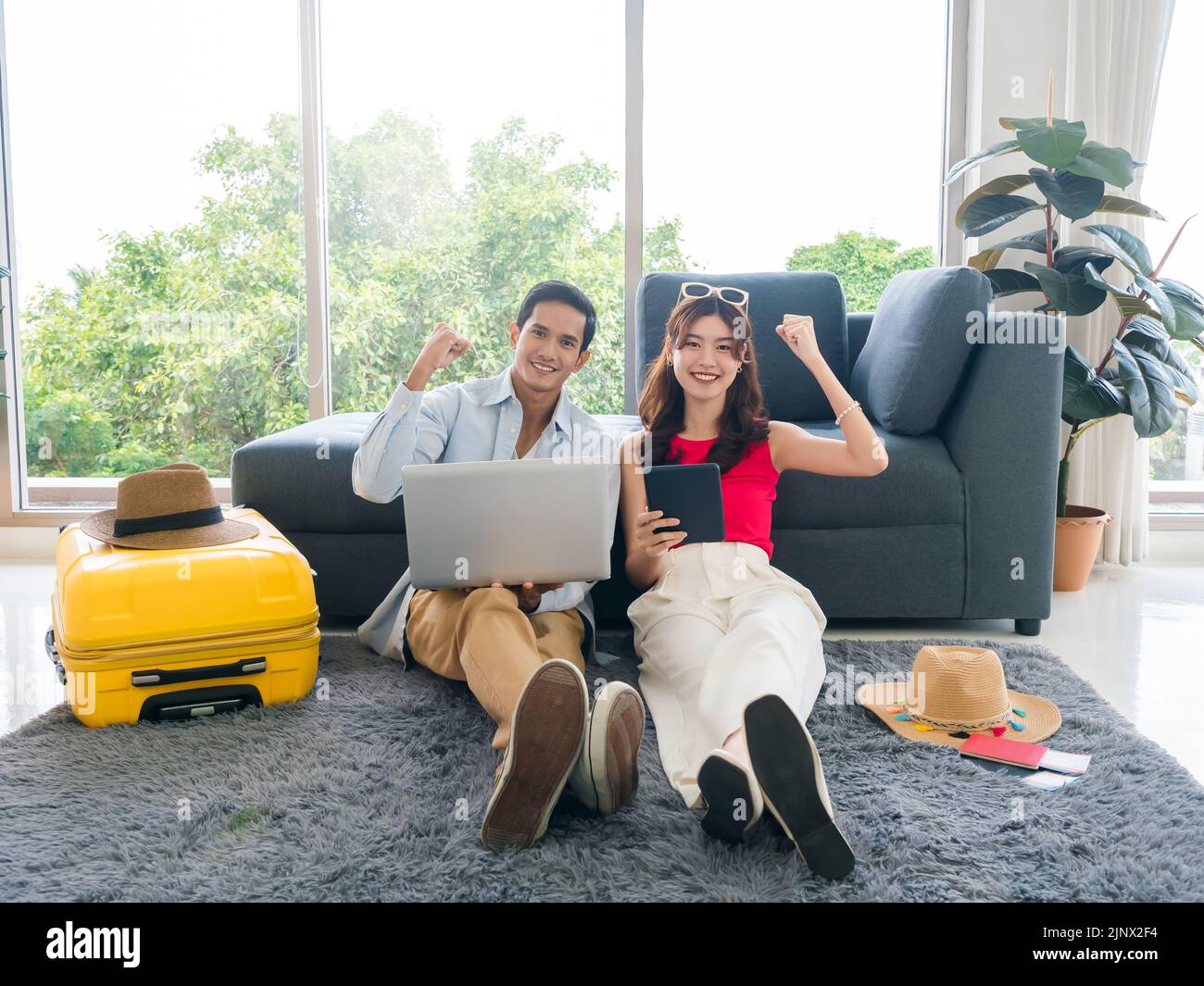 Happy Asian couple ready to trip, young man and woman, showing success ...