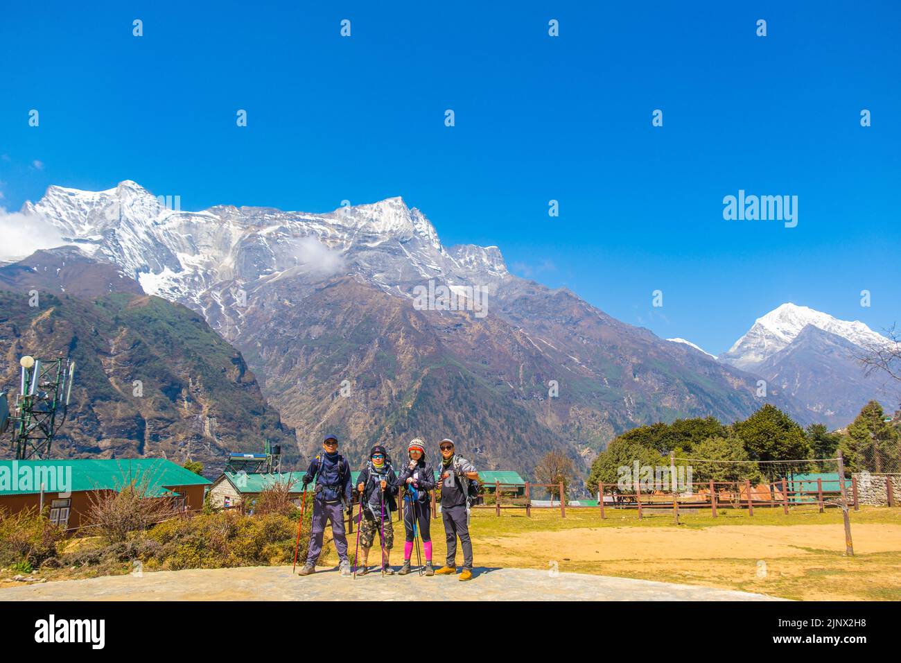 Namche Bazaar, Nepal - 23 Apr 2022 : Asian tourist group watching and ...