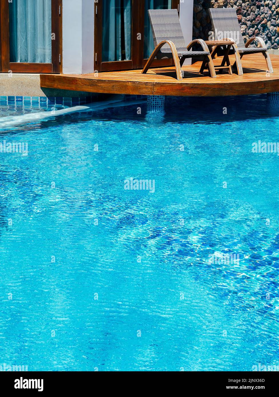 Poolside decoration with wood plank deck terrace near the room at the ...