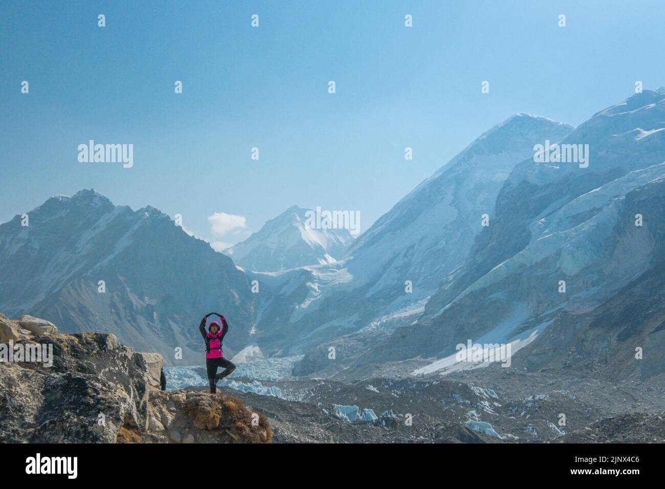 Female backpacker enjoying the view on mountain walk in Himalayas ...