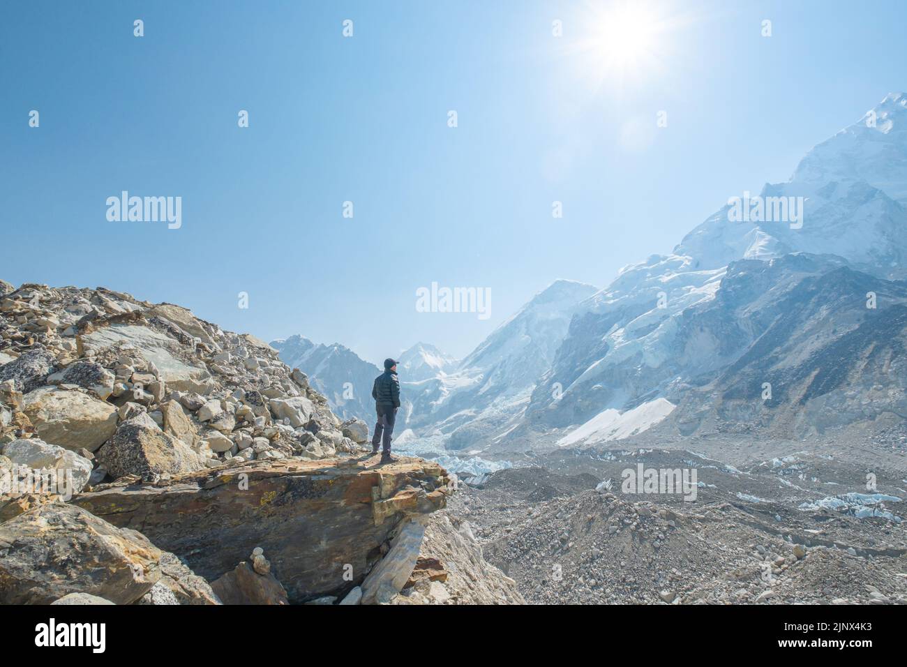 Male backpacker enjoying the view on mountain walk in Himalayas. Everest Base Camp trail route ...