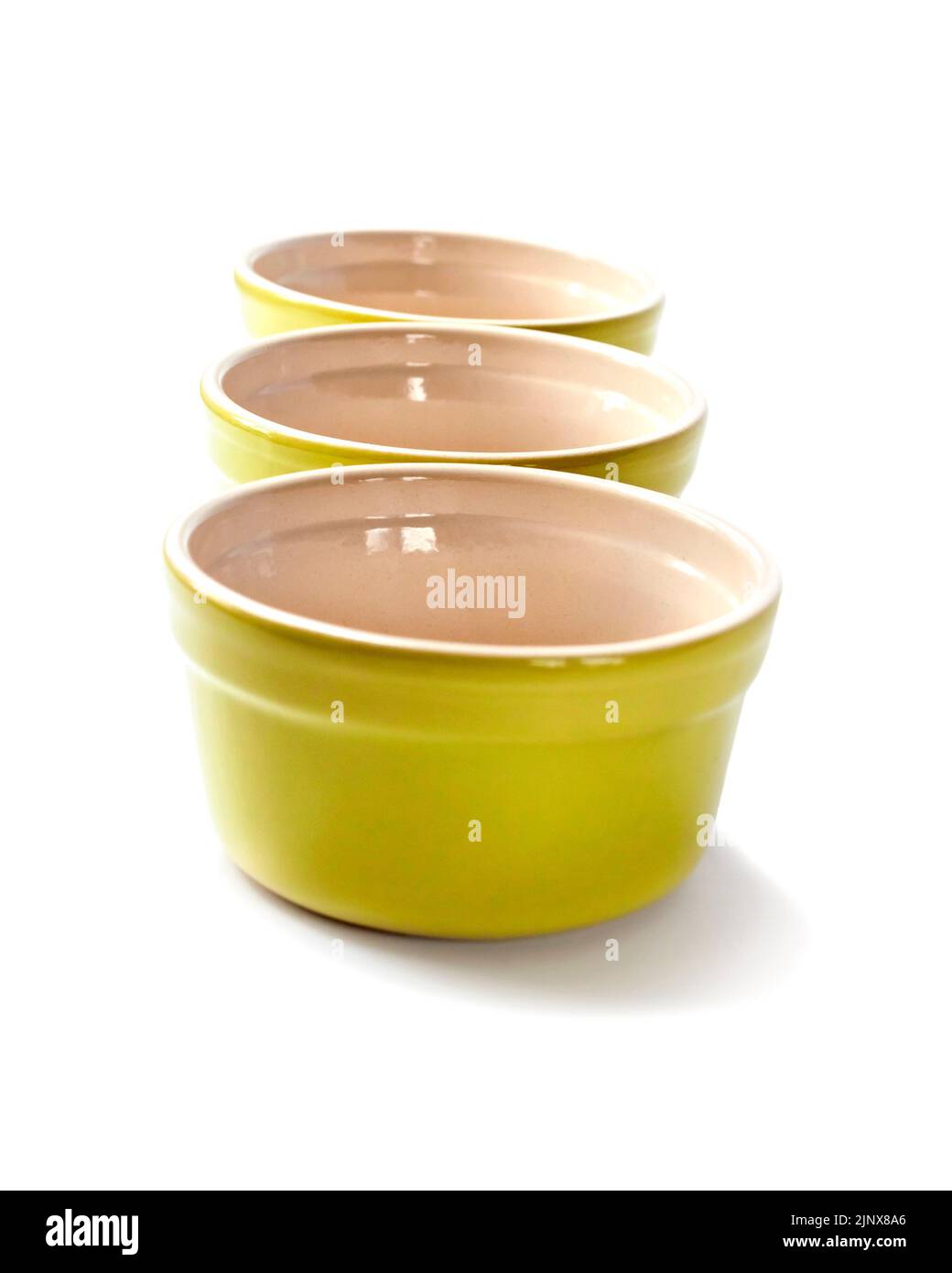 Glazed ceramic pots for cooking on a white background Stock Photo - Alamy