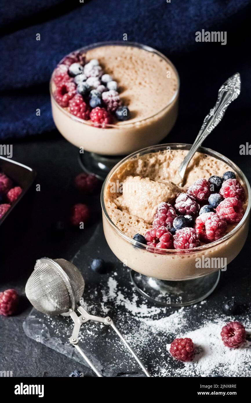 Ryazhenka (fermented baked milk) mousse in glass bowls decorated with ...