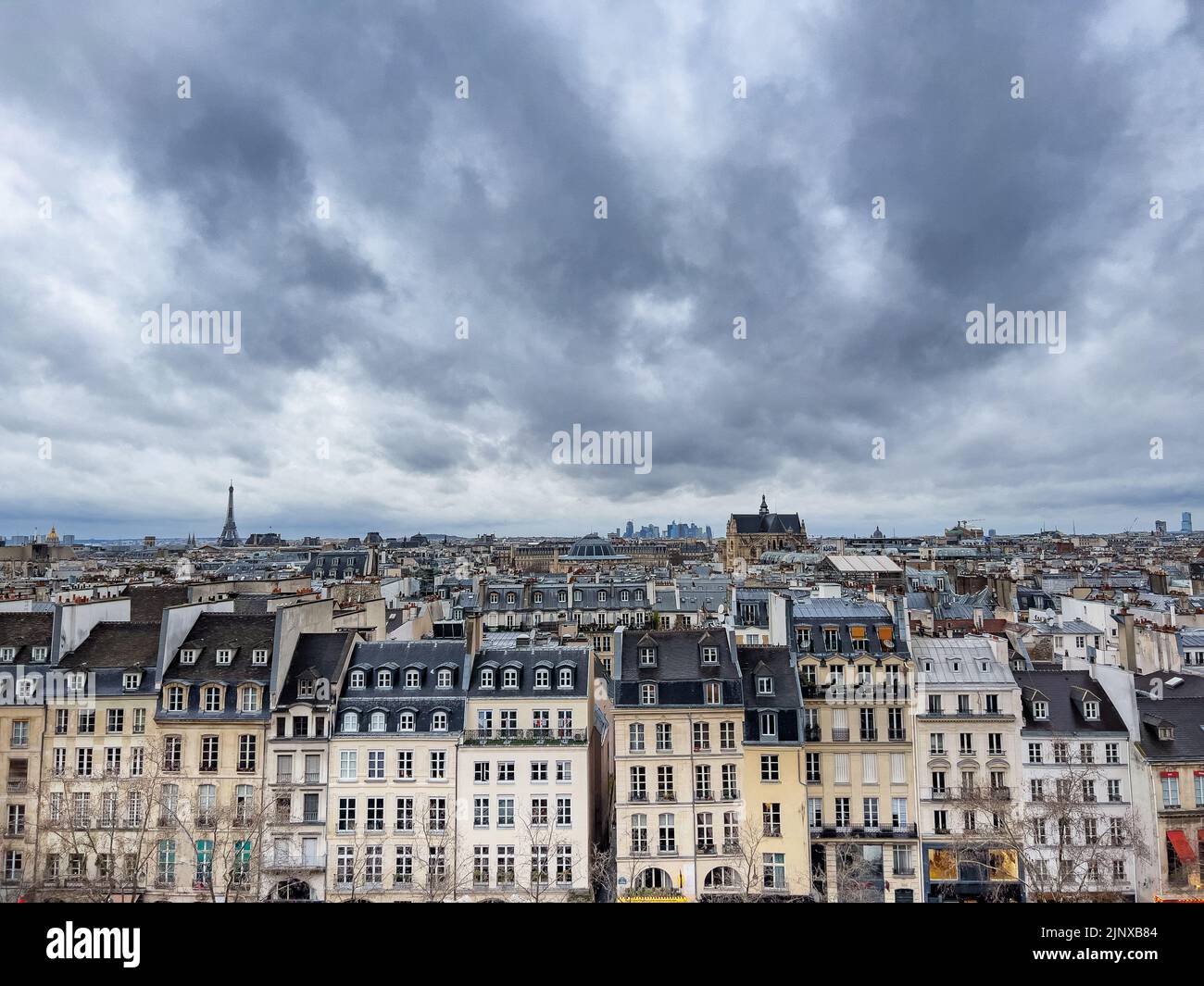 Rows of old Paris Haussmann houses and churches in downtown Stock Photo ...