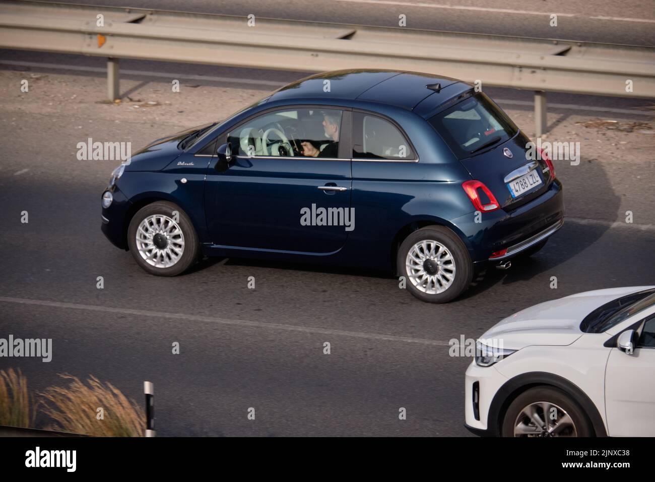 Driver in a Fiat 500 using mobile phone while driving on spanish ...