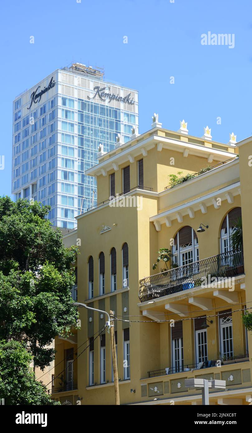 The modern Kempinski hotel and a beautiful old historical building on ...