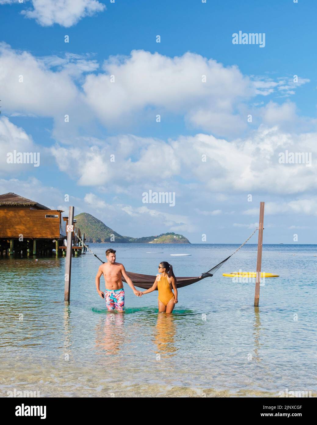 Couple on the beach of the tropical Island Saint Lucia or St Lucia Caribbean, holiday vacation ...