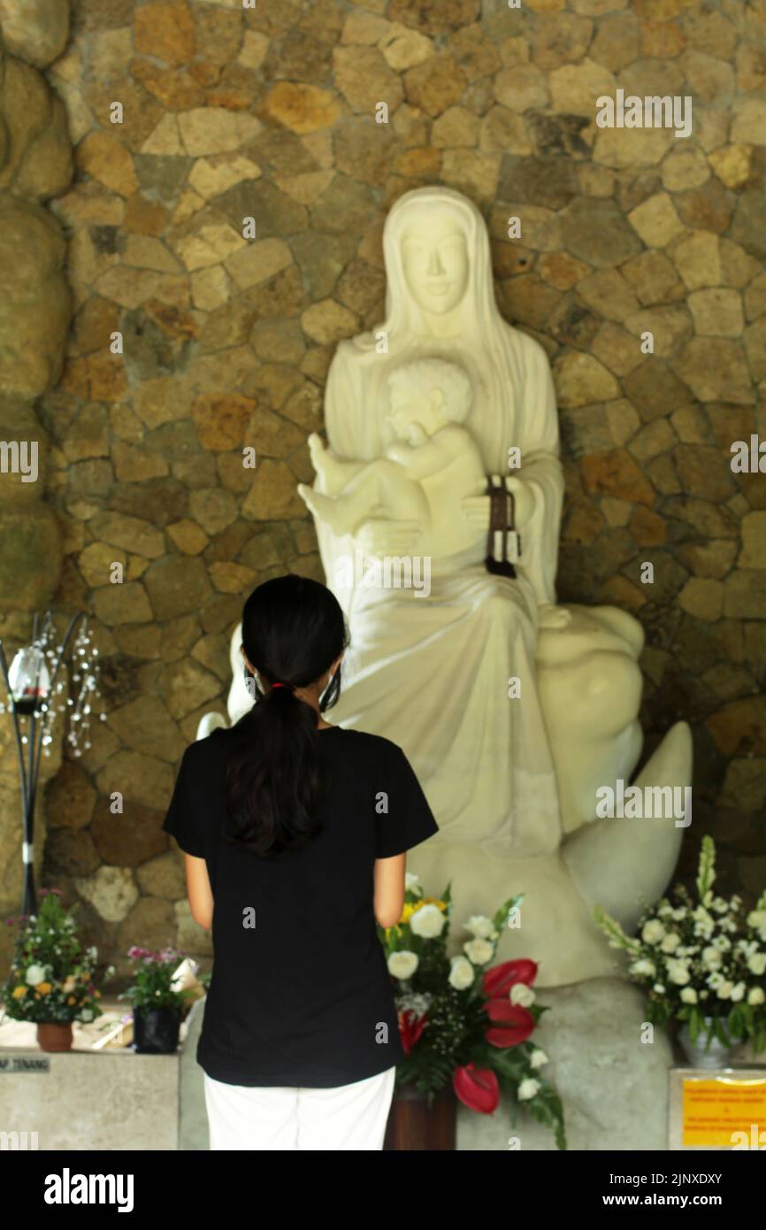 Statue of Mother Mary and Baby Jesus Christ on lap. With junior ...