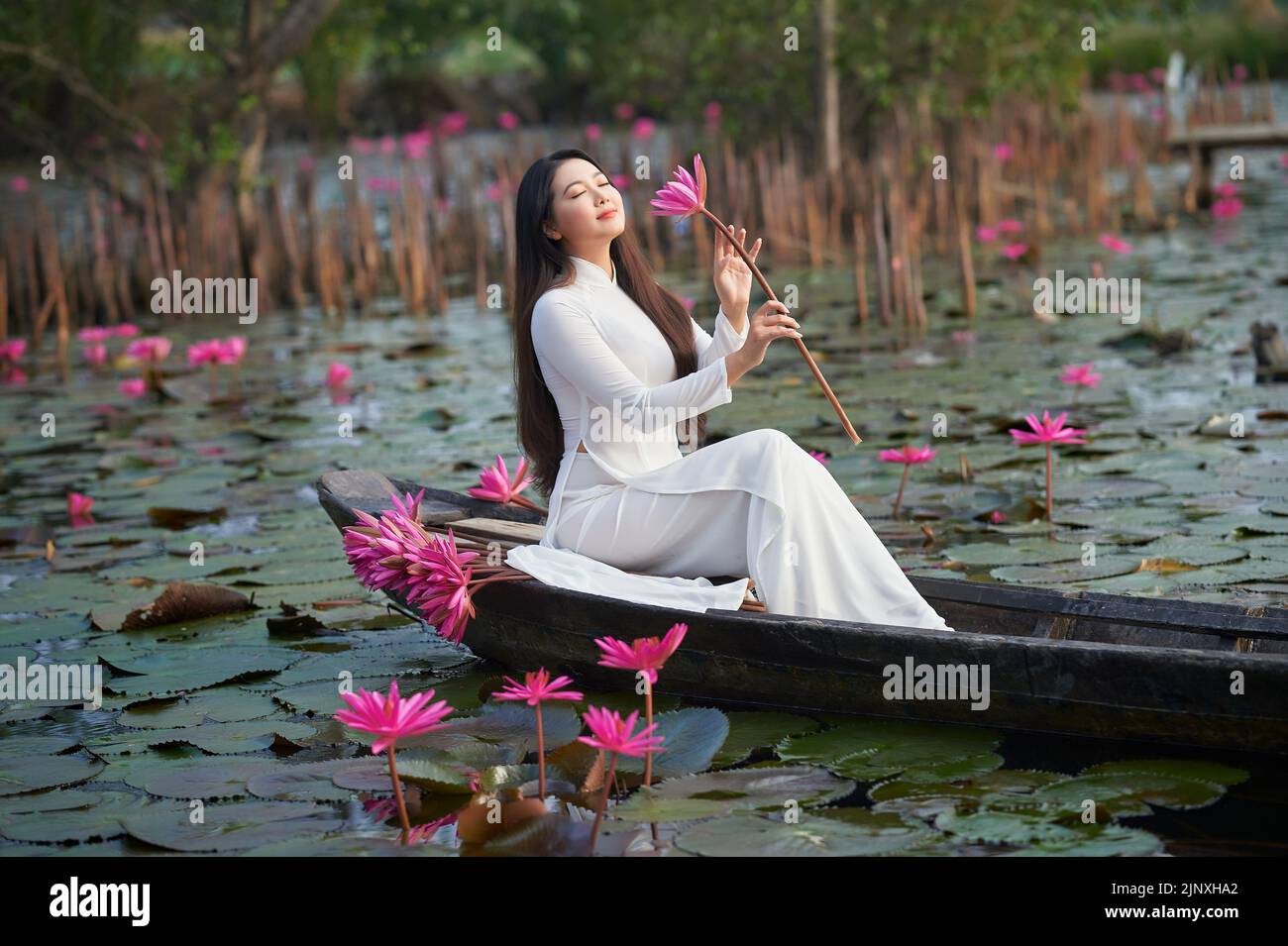 Ho Chi Minh City, Vietnam: a beautiful Vietnamese student in white ao ...