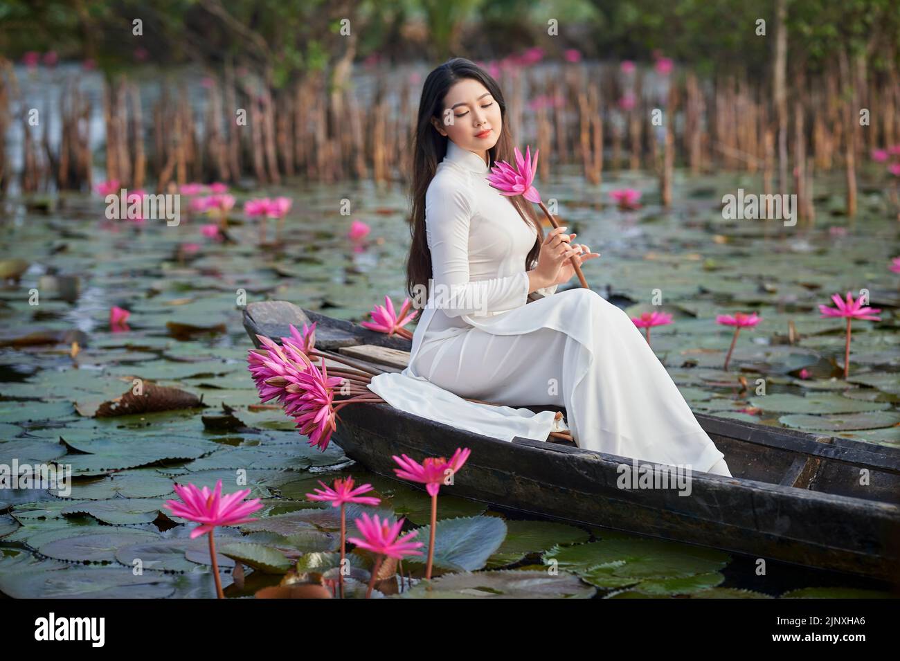 Ho Chi Minh City, Vietnam: a beautiful Vietnamese student in white ao ...