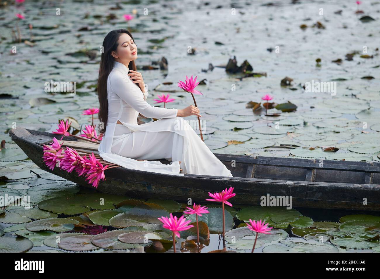 Ho Chi Minh City, Vietnam: a beautiful Vietnamese student in white ao ...
