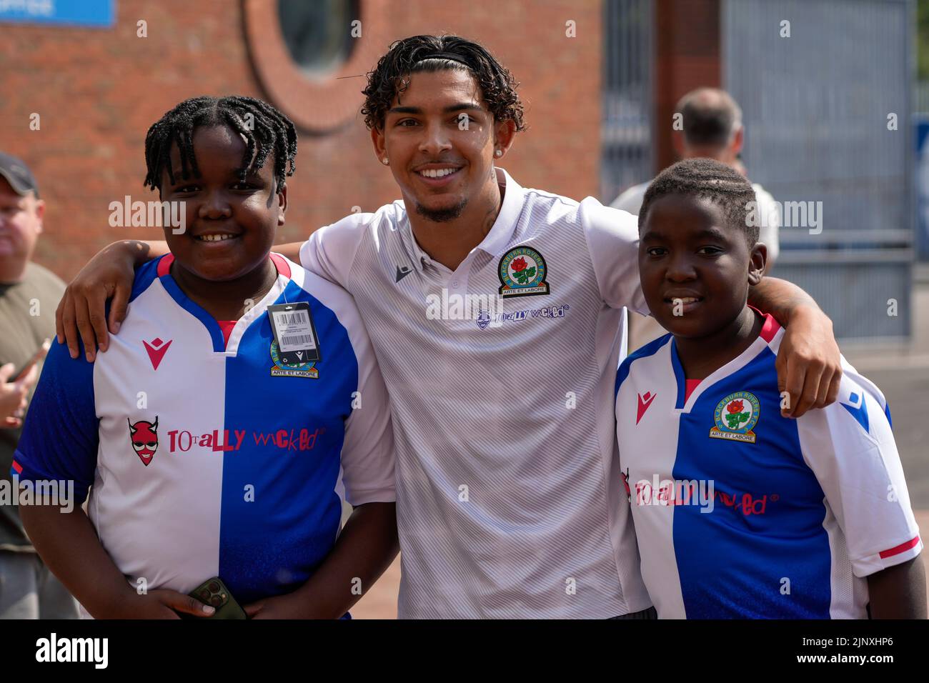 Tyrhys Dolan #10 of Blackburn Rovers poses for a photo with young ...