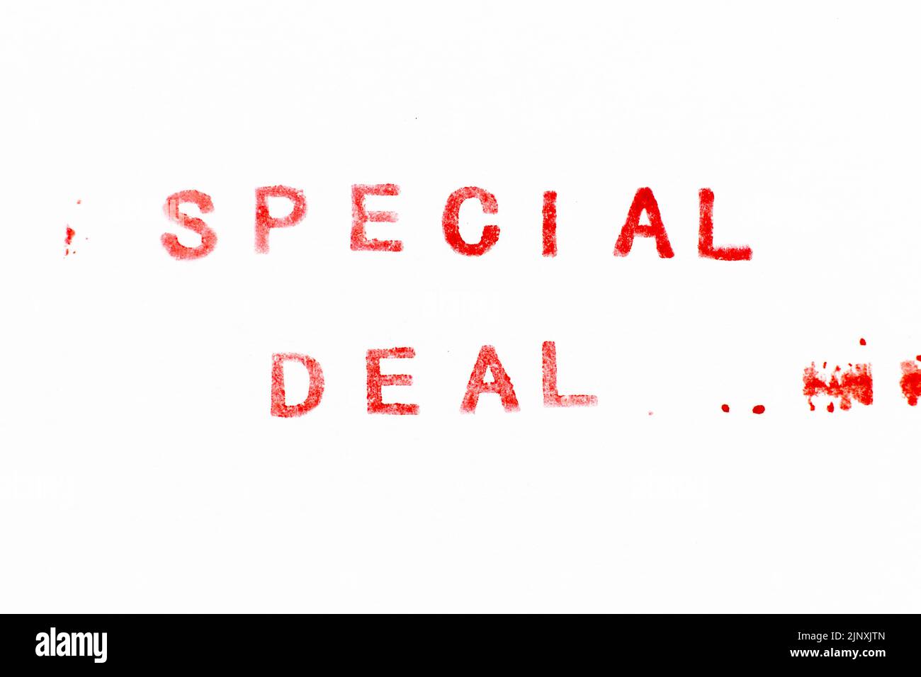 Red color ink rubber stamp in word special deal on white paper ...