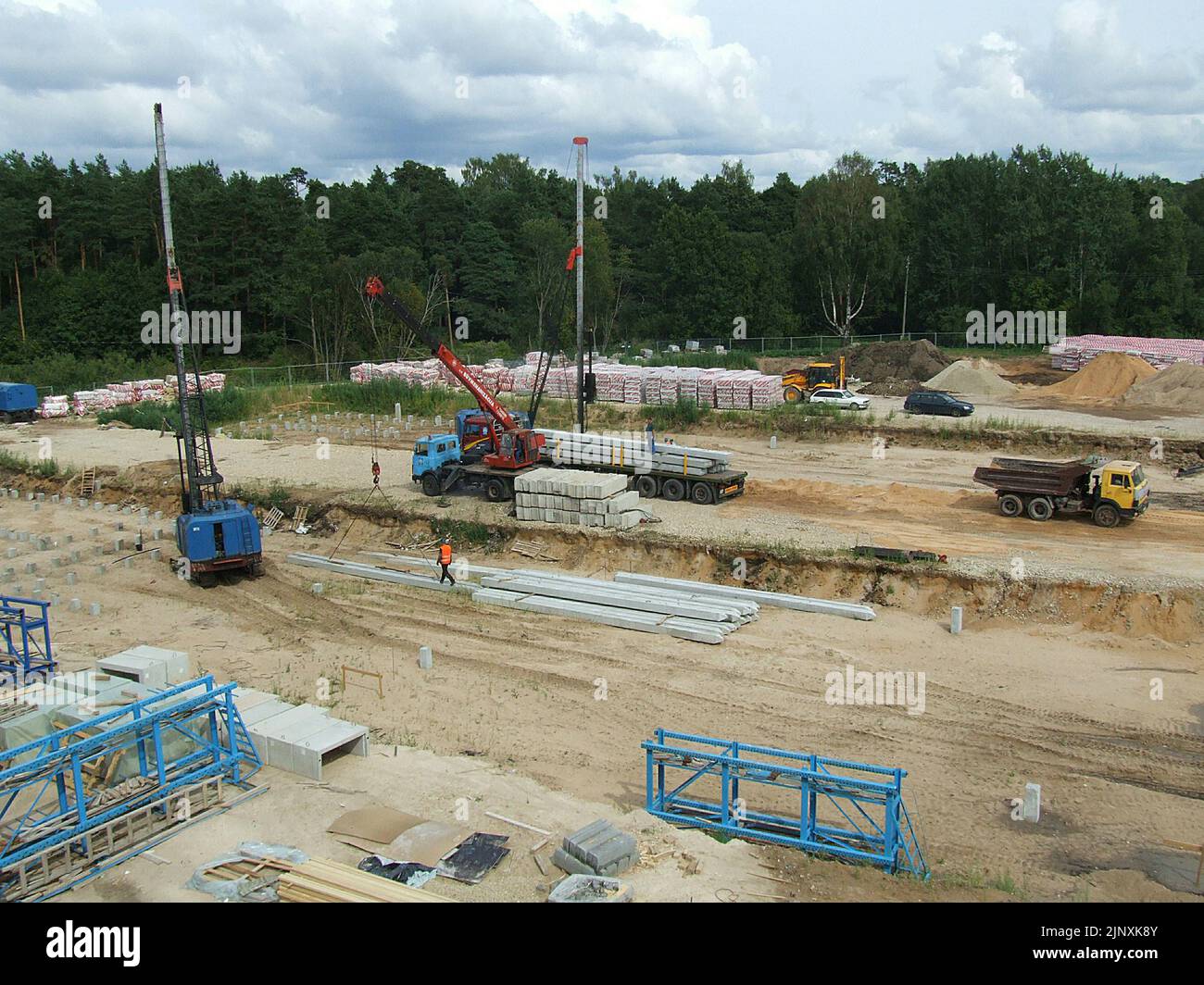Latvia, Riga. Laying foundations for residential buildings. Unloading ...