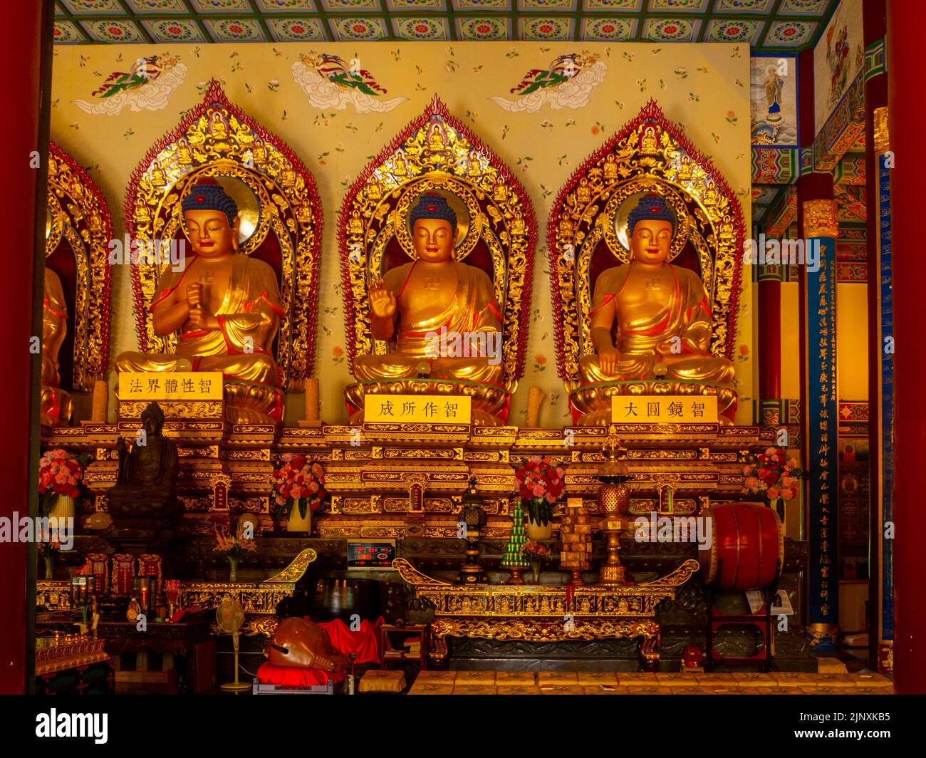 Front view of a group of traditional Chinese religious statues or ...