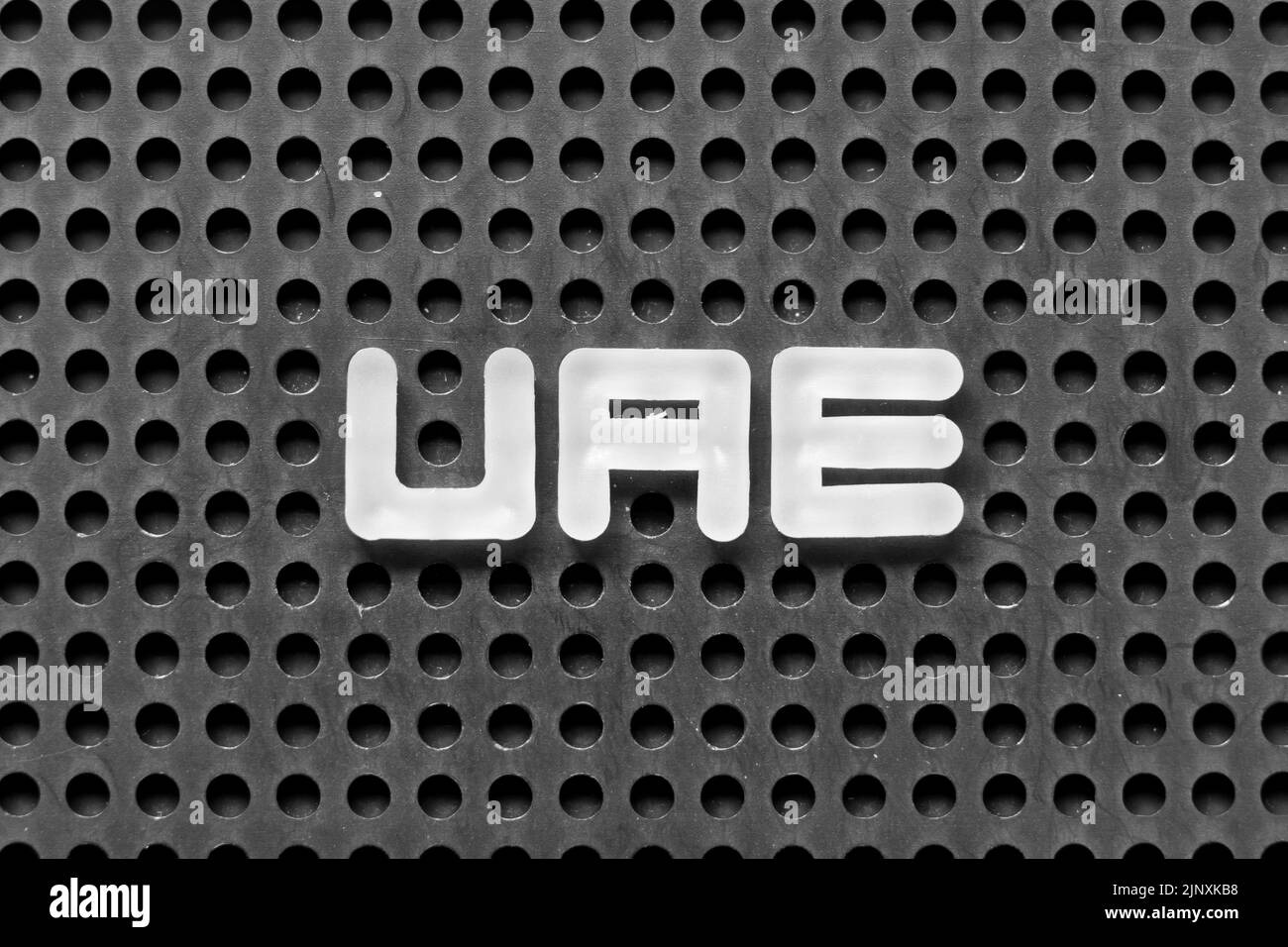 White alphabet letter in word UAE (Abbreviation of United Arab Emirates ...