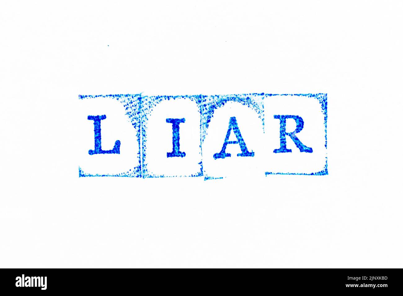 Blue color ink rubber stamp in word liar on white paper background ...