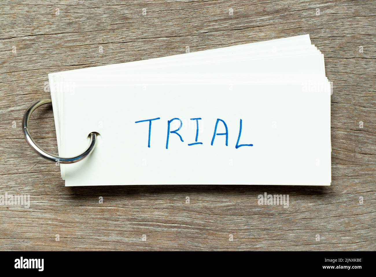 Flash card with handwriting word trial on wood background Stock Photo ...