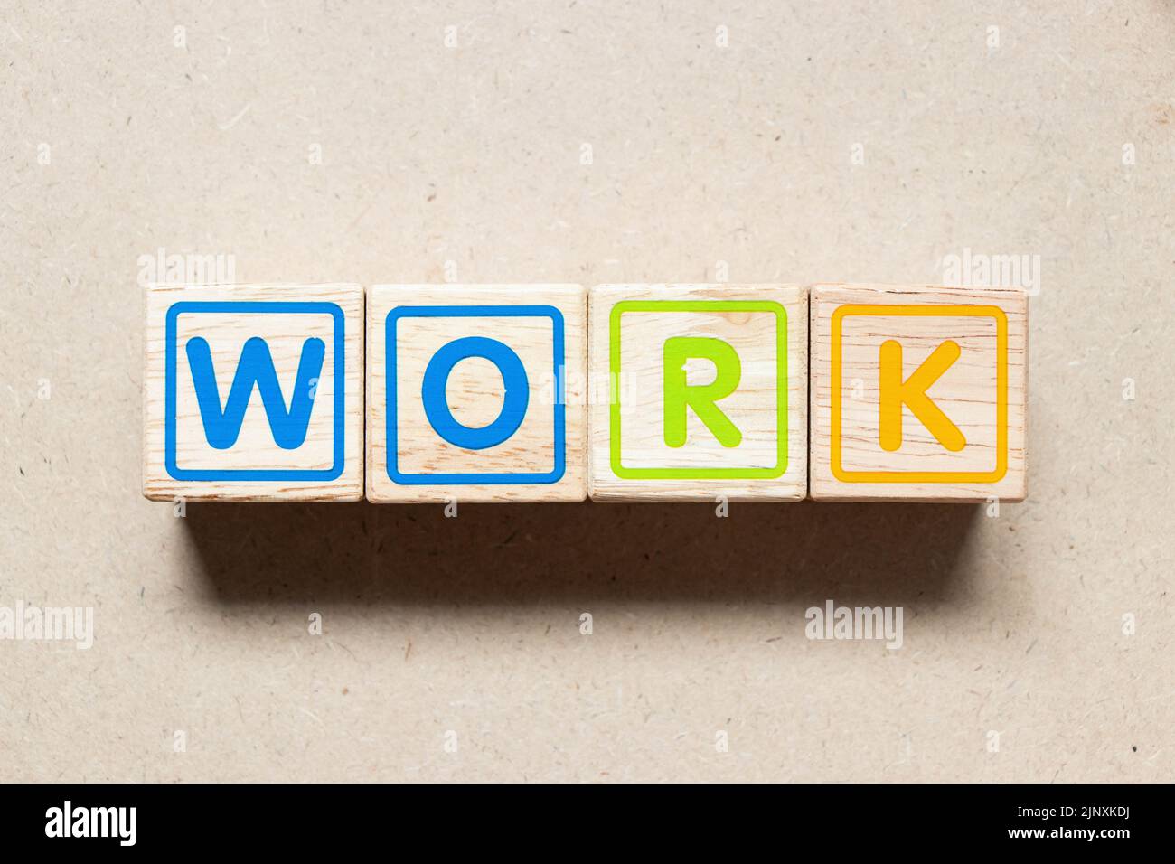 Color letter block in word work on wood background Stock Photo - Alamy