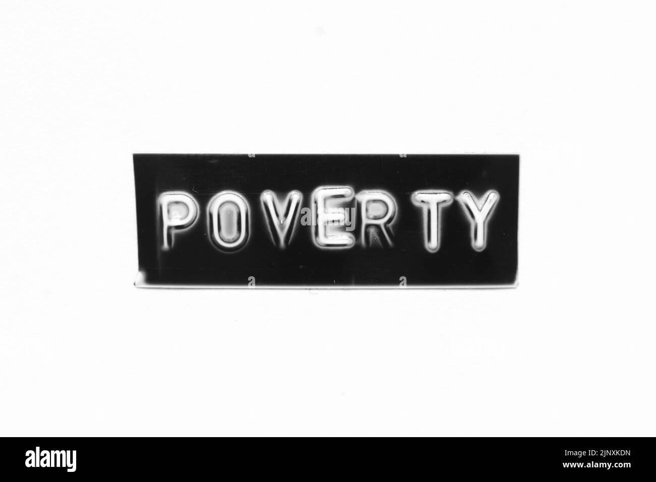 Black color banner that have embossed letter with word poverty on white ...