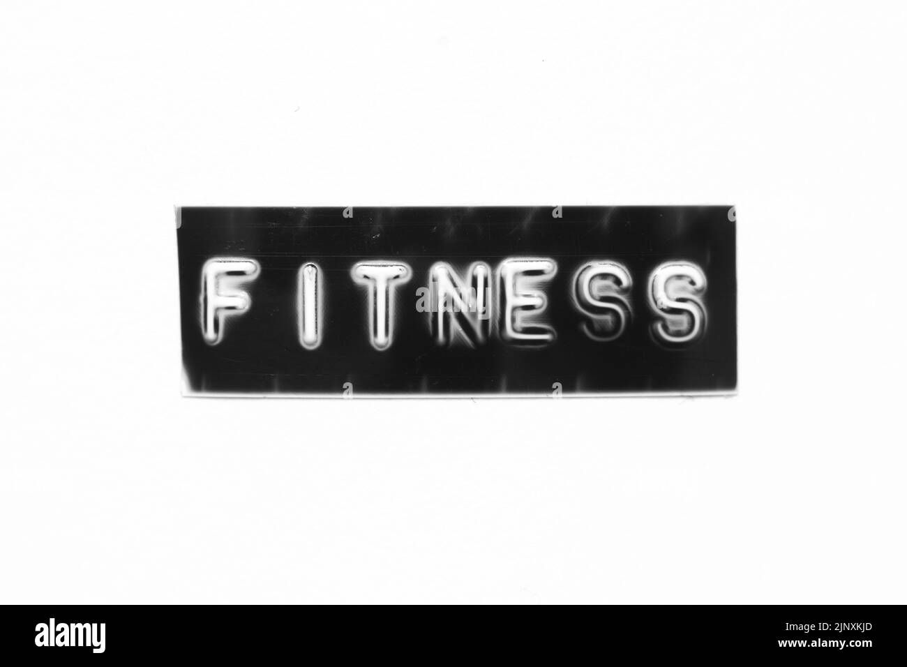Black color banner that have embossed letter with word fitness on white ...