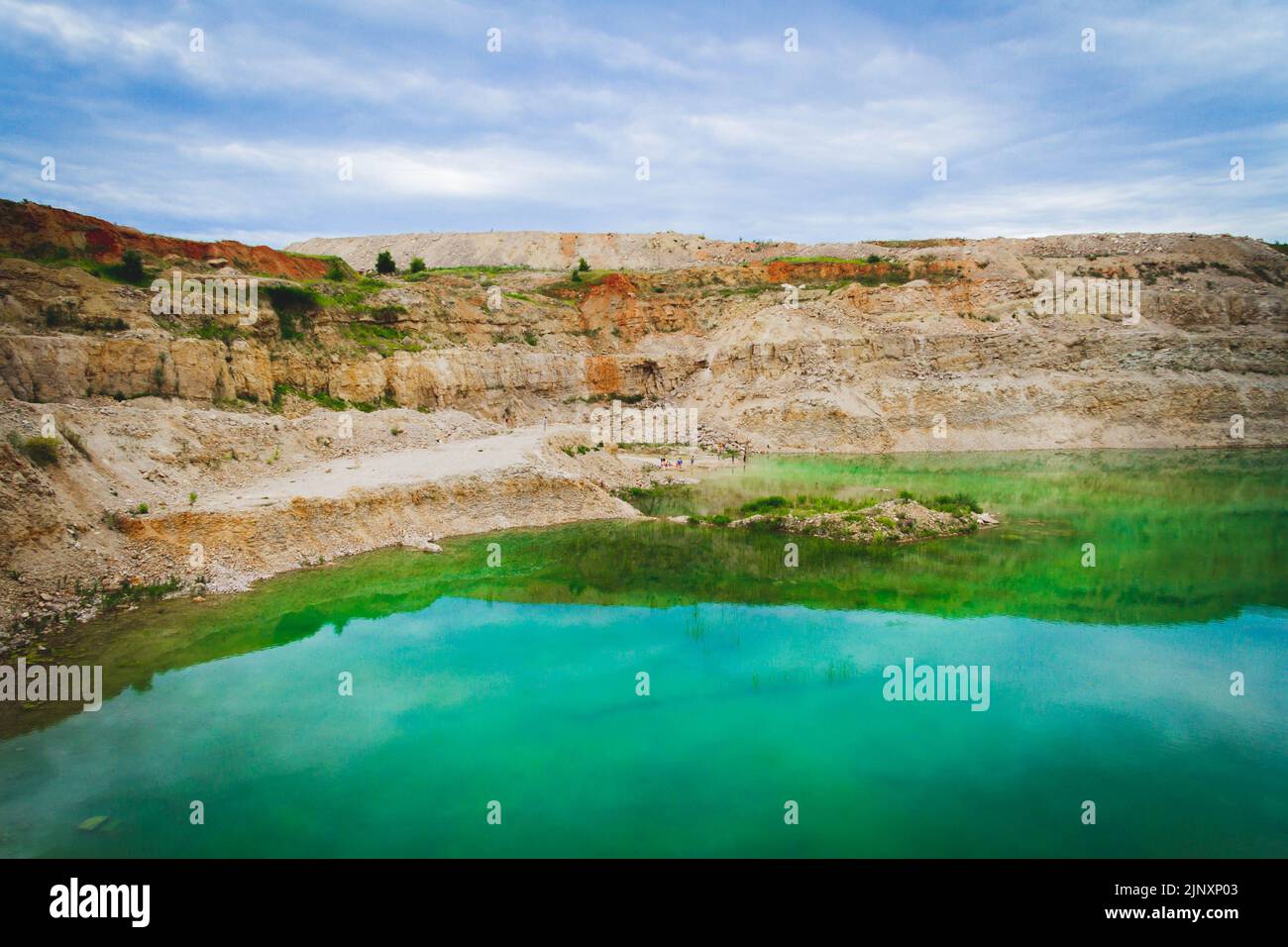 Lake formation in an old abandoned quarry. Quarry lake. Crushed stone ...