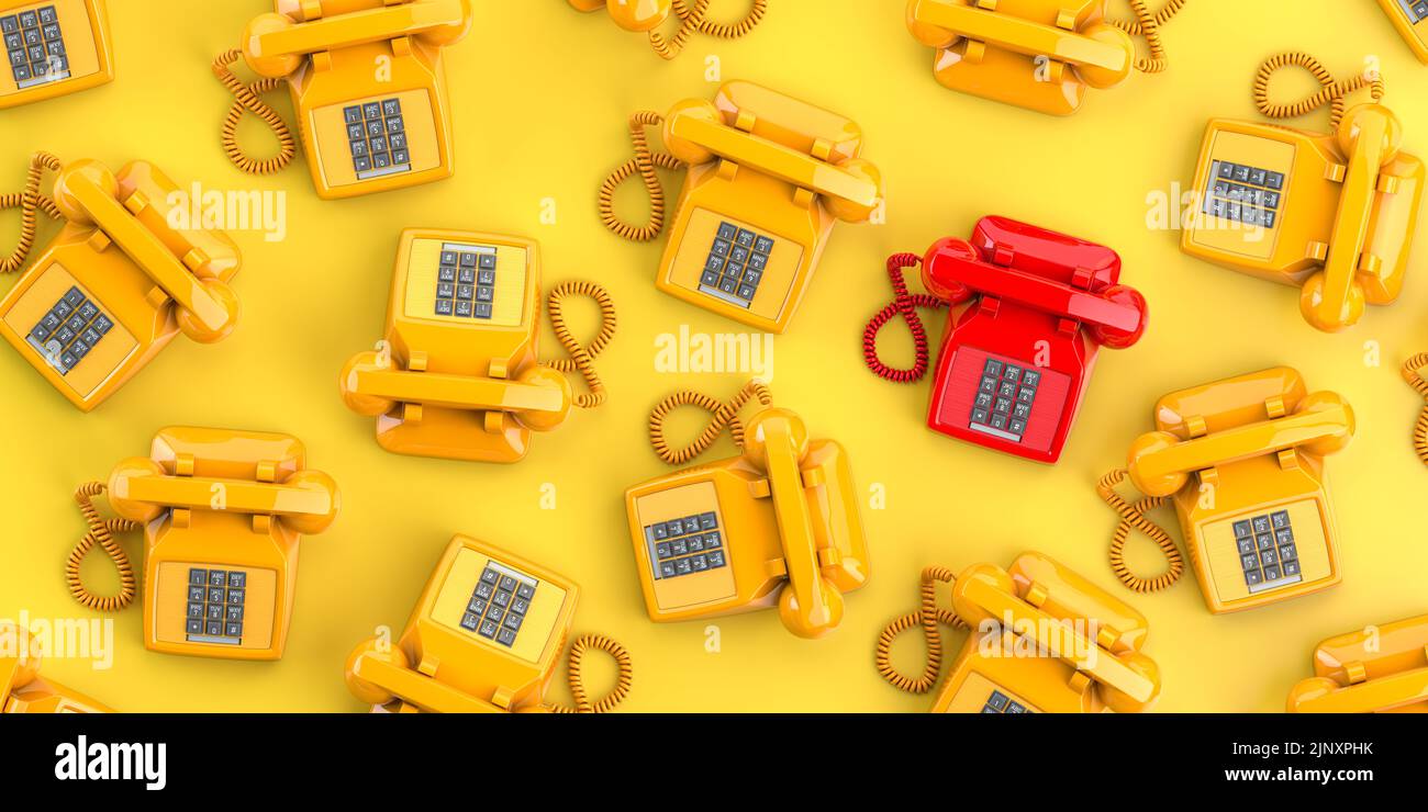 Red vintage telephone on background from yellow retro telephones ...