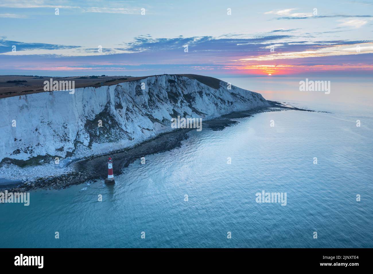 Beautiful Summer sunrise landscape image of Beachy Head Lighthouse in ...