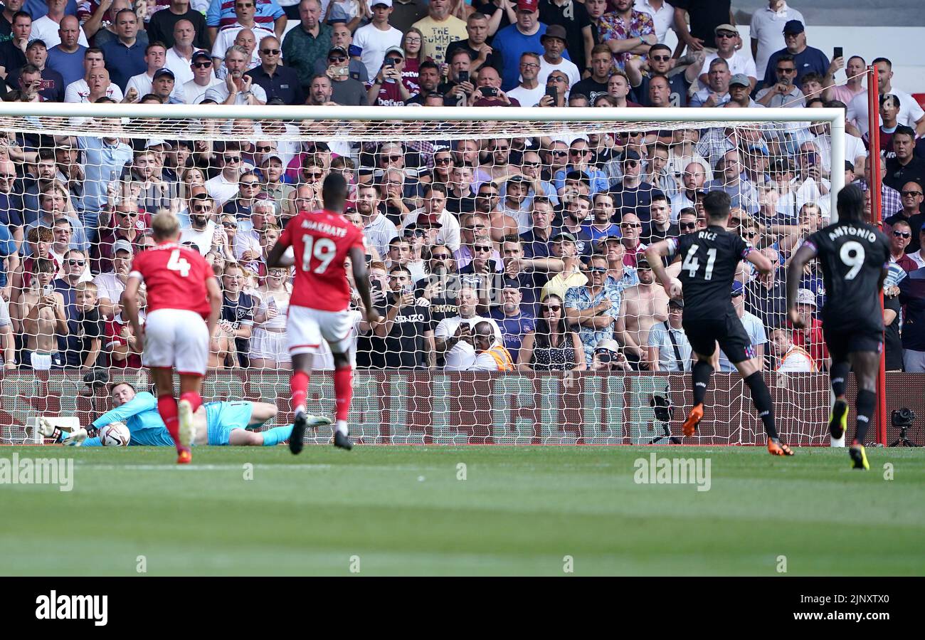 West Ham United's Declan Rice (seconf right) sees his penalty kick ...