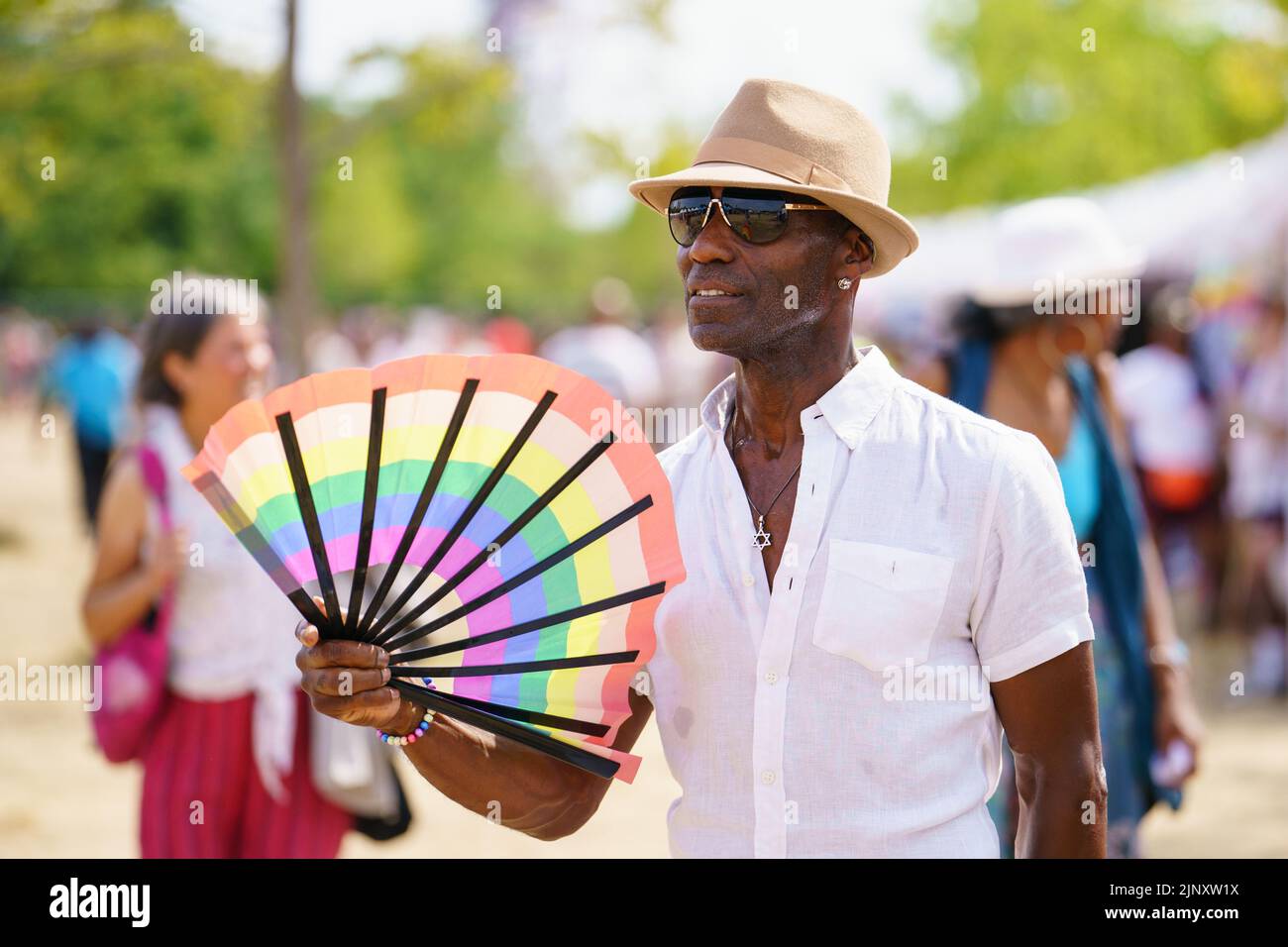 Revellers use fans to keep cool as they attend UK Black Pride, Europe's ...