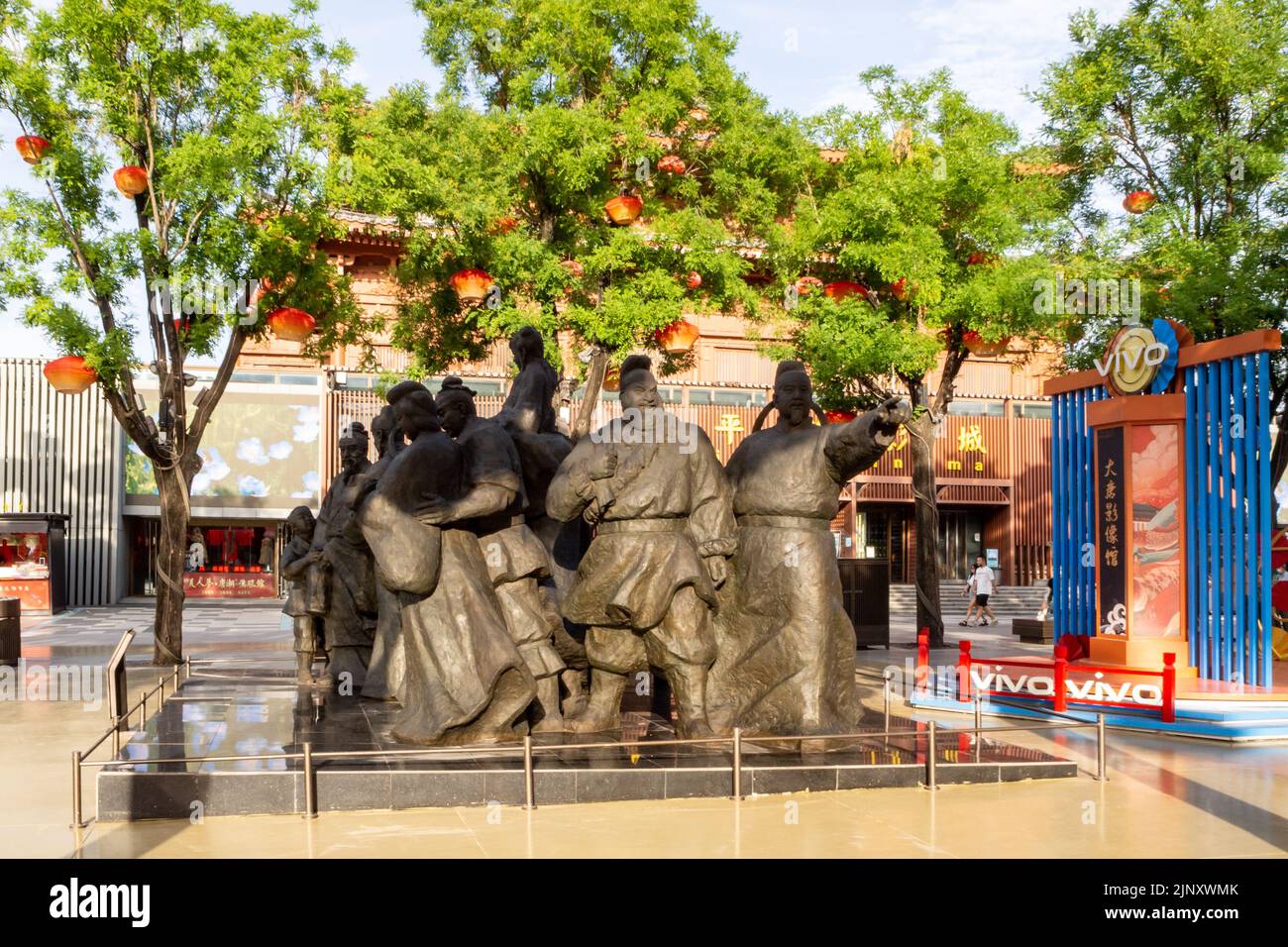 Xian, China, 2022, Sculpture of a group of people in a city plaza or ...