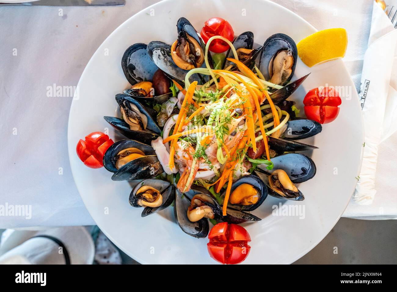 A Typical Seafood Dish Served At Restaurant In Ammoudi Bay, Oia ...