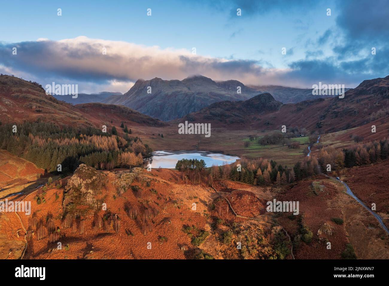 Epic aerial drone landscape image of sunrise from Blea Tarn in Lake ...