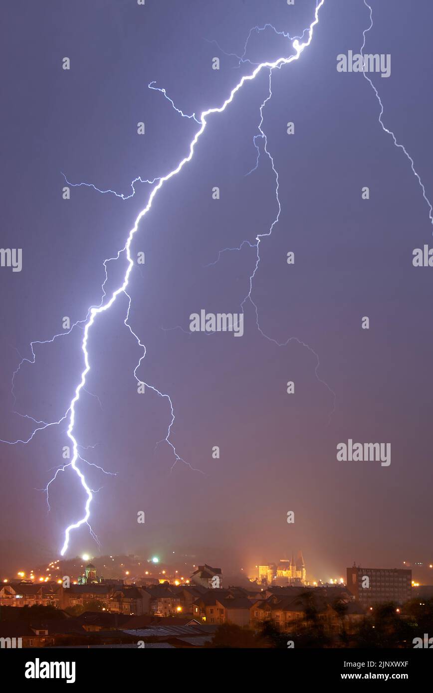 Storm Clouds and Lightning Bolts above the City Stock Photo - Alamy