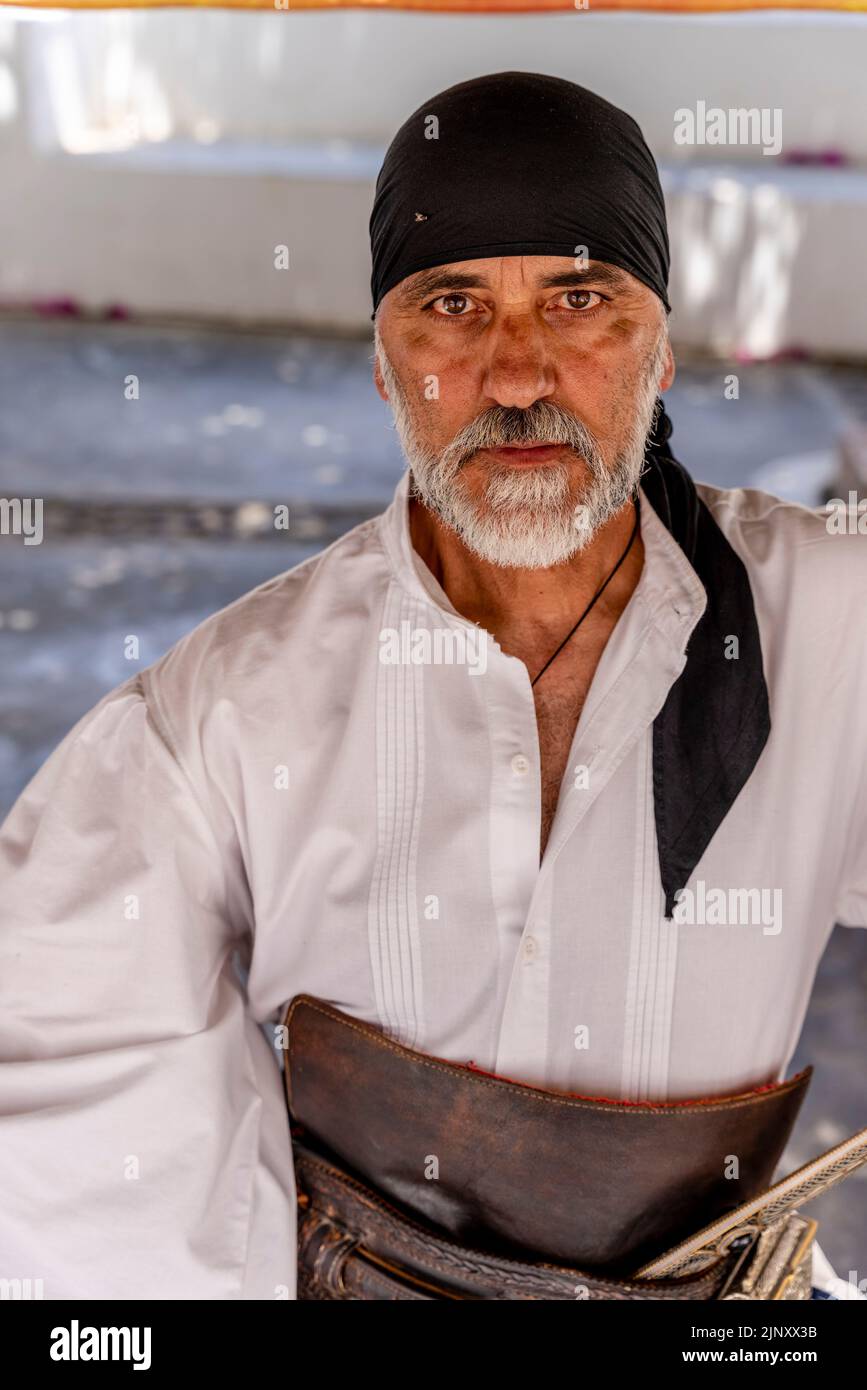 A Local Man Dressed In Traditional Costume On The Island Of Santorini ...