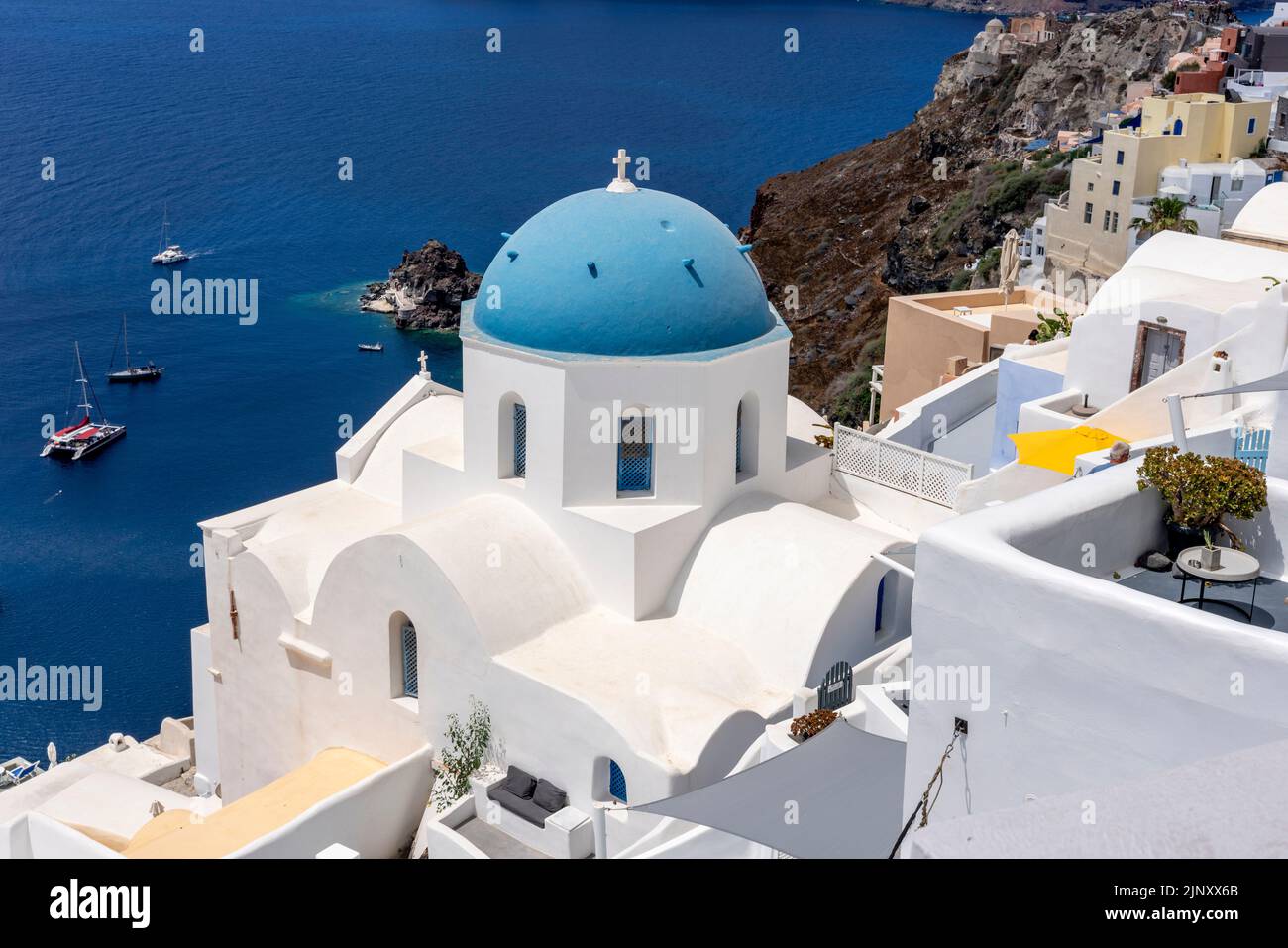 A Classic View Of A Blue Dome Church In The Town Of Oia, Santorini ...
