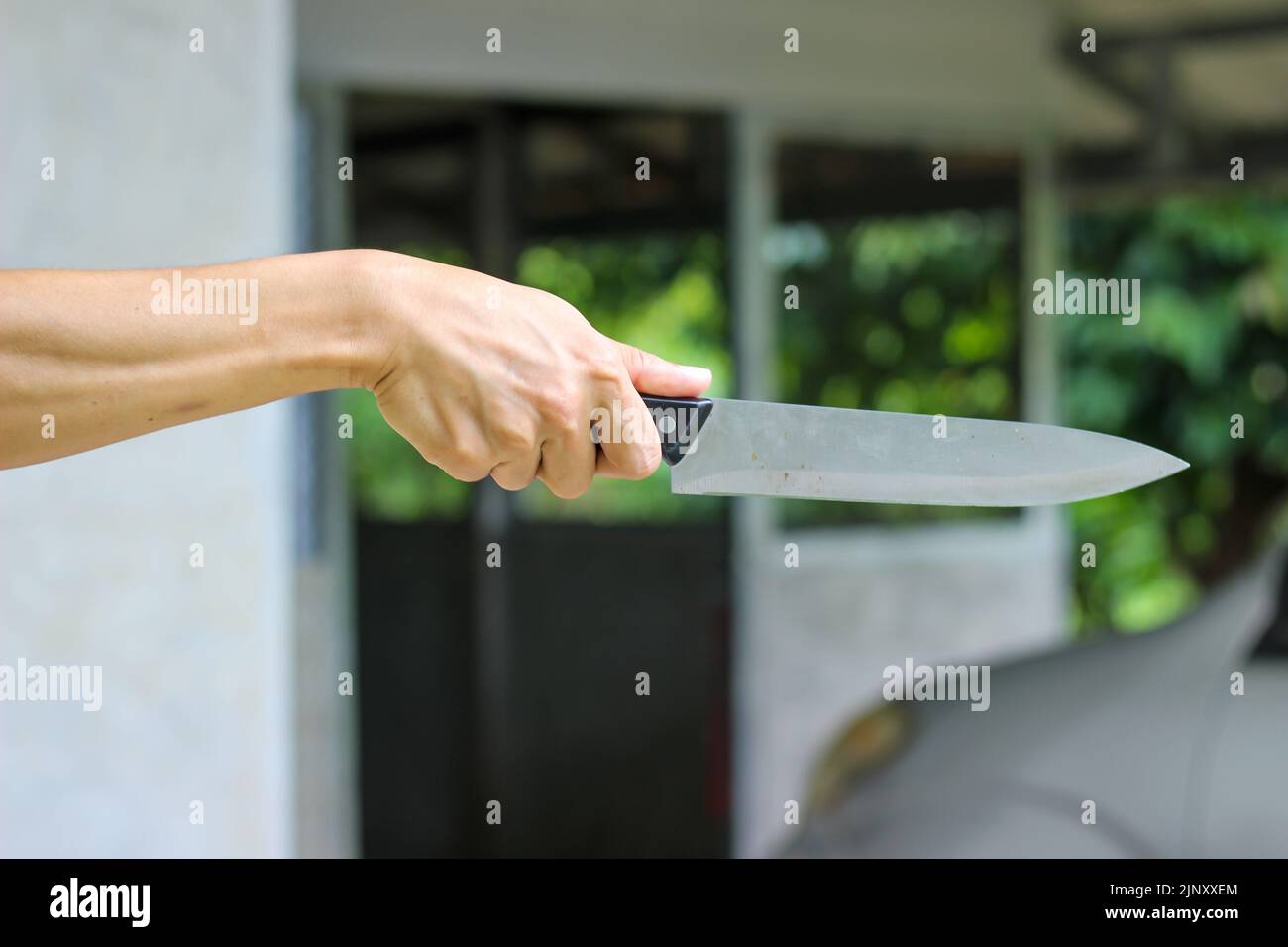 Male hand holding knife, concept of crime or violence Stock Photo - Alamy