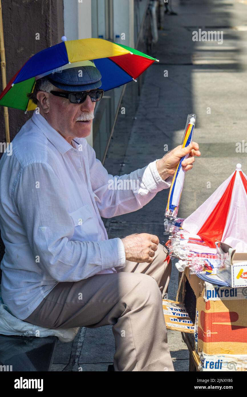Head fitted parasol hi-res stock photography and images - Alamy