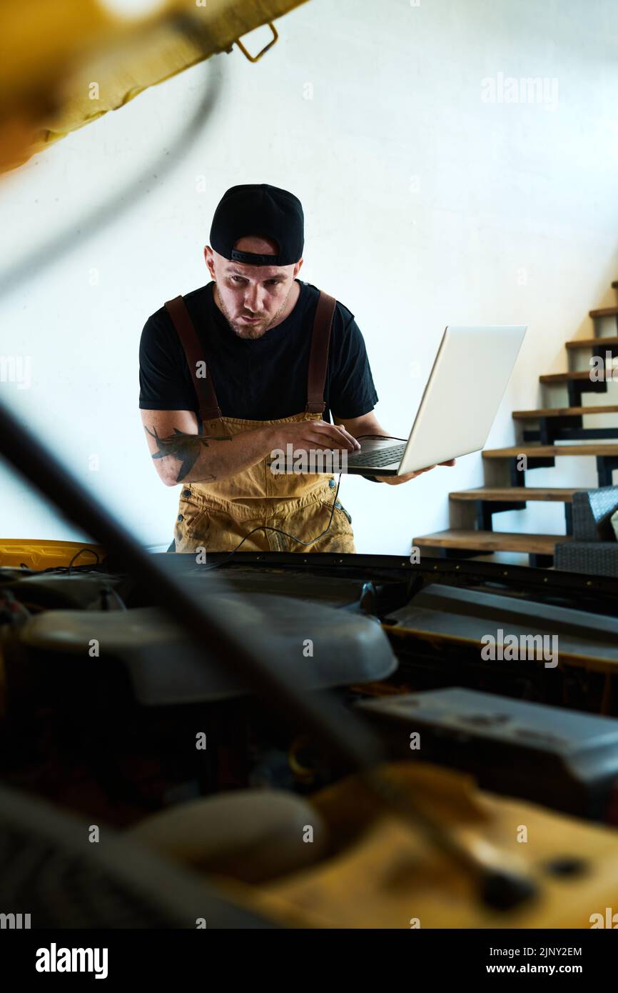 Young man bending forwards hi-res stock photography and images - Alamy