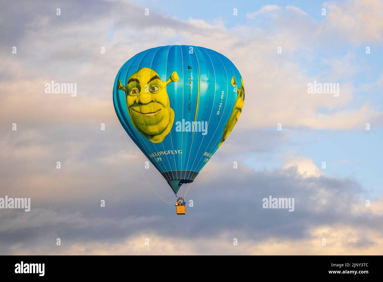 View of Shrek hot air balloon in cloudy blue sky. Sweden. Uppsala Stock ...