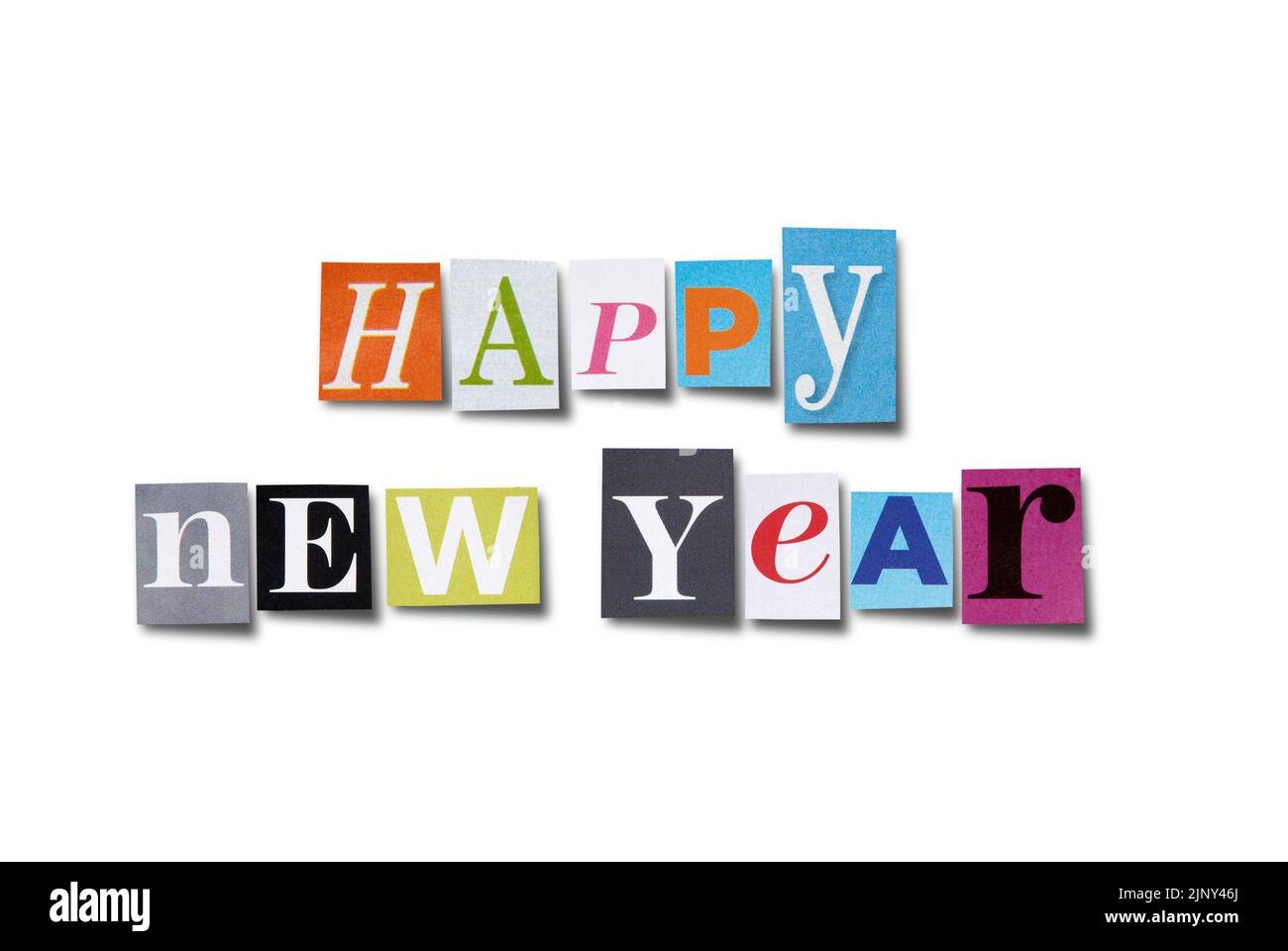 Letters cut from magazines spelling Happy New Year, isolated on white ...