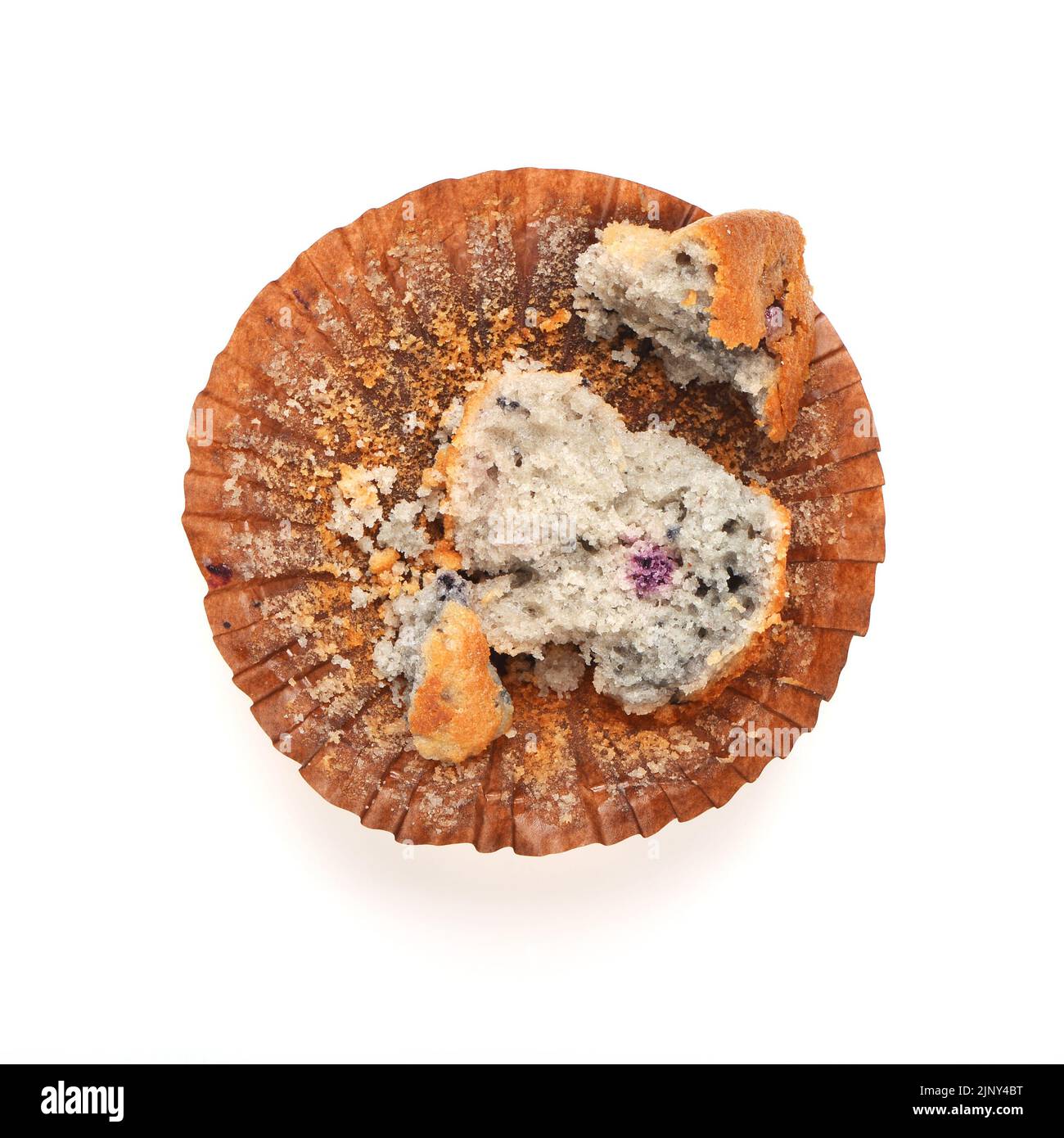 Part eaten muffin with remnants left in bun case shot from above ...