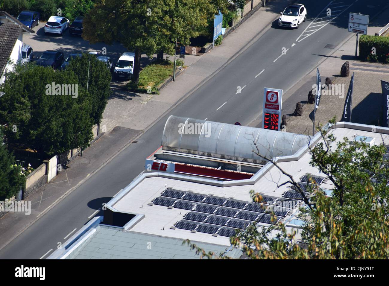 main road with a petrol station and solar panels Stock Photo - Alamy
