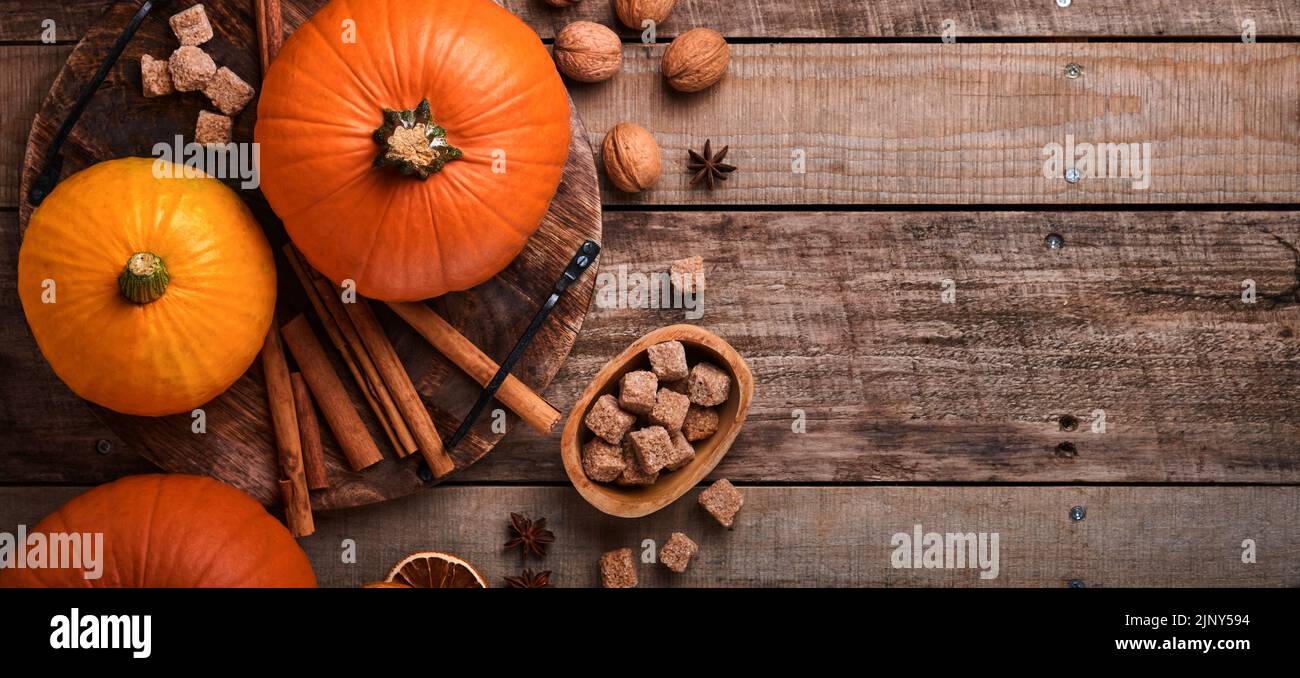 Pumpkin. Autumn food background with cinnamon, nuts and seasonal spices ...