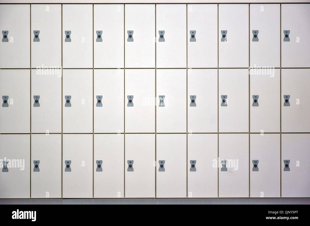 three rows of closed white wardrobe boxes Stock Photo - Alamy