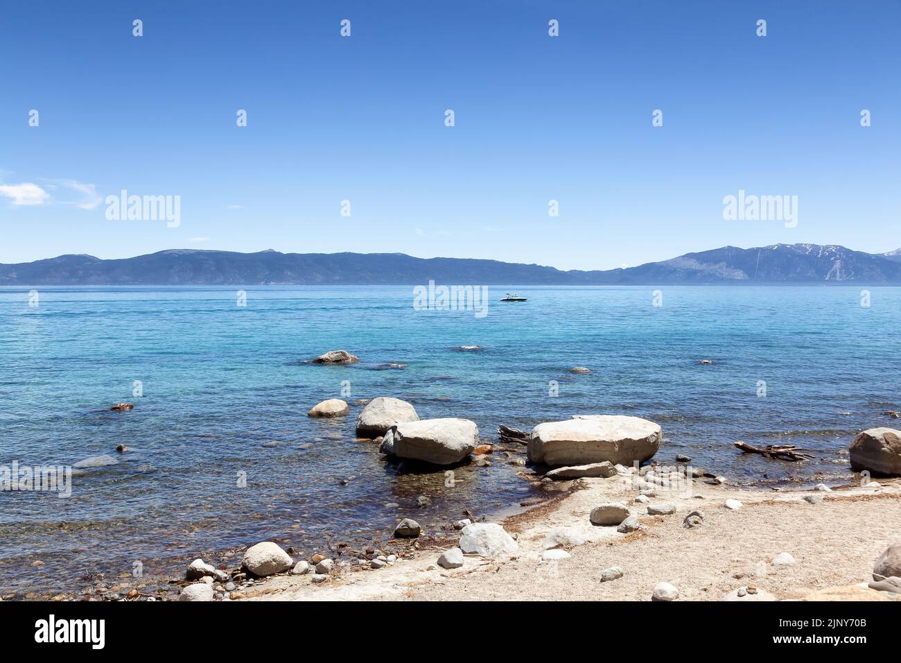 Beach with Sand and Rocks at Lake surrounded by Mountains. Summer ...